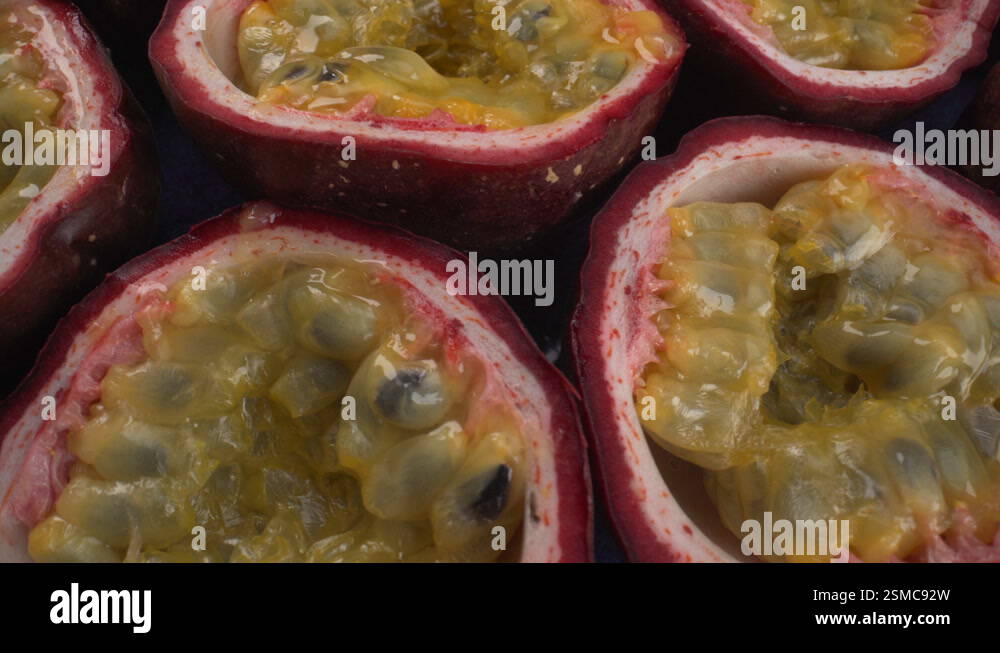 Rotating passion fruits close up, juicy tropical maracuya, exotic fruit ...