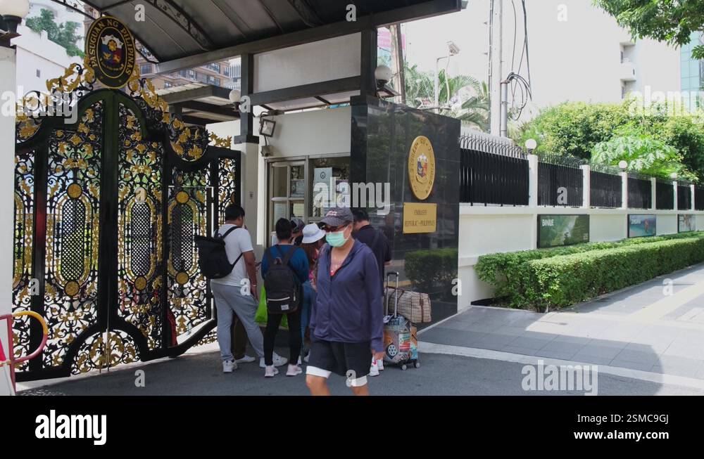 Some Filipino nationals in front of the Philippine emabassy gate ...