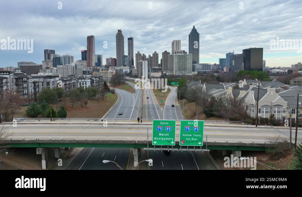 Aerial flyover of Jackson street bridge with the atlanta skyline in the ...