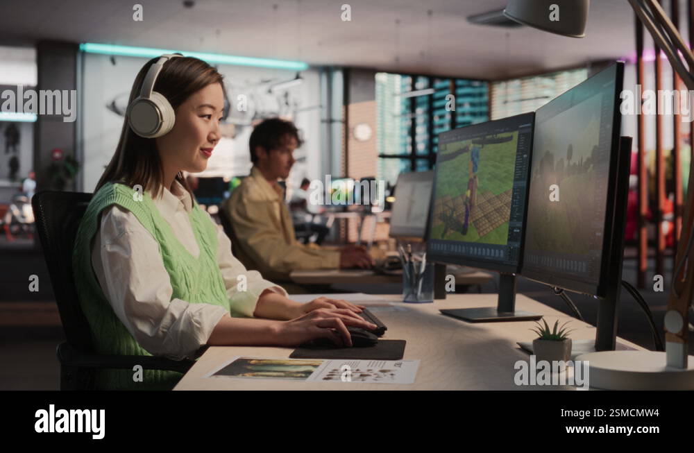 Female Asian Game Developer Working On Computer In Office Stock Video ...