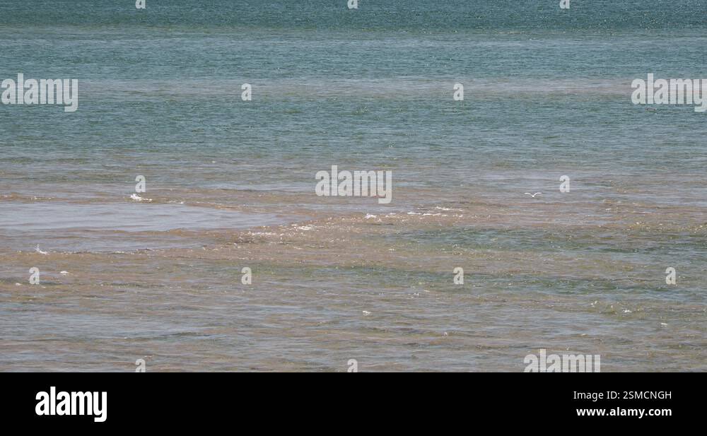 The tide rushing out of the Duddon estuary at Hodbarrow, Millom ...