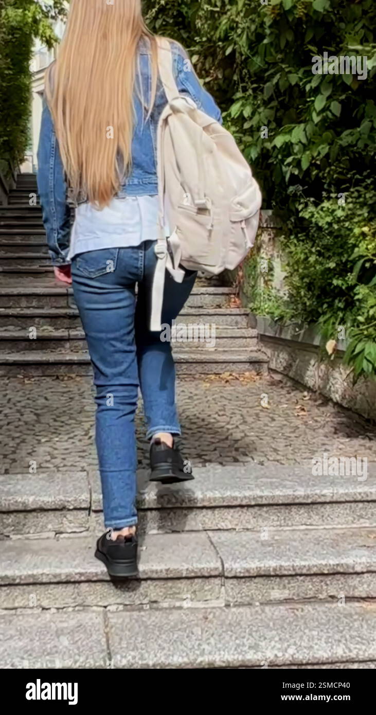 Woman tourist walking on a path with green trees. Concept of tourism ...