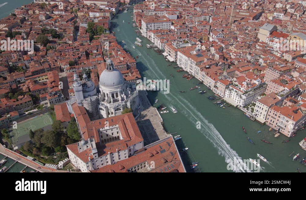 birds eye view of classic venice italy midday with boats and cathedrals ...