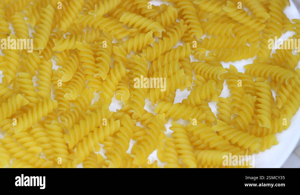 Uncooked Pasta - Top View. Fat and Unhealthy Food. Dry Spiral Macaroni ...