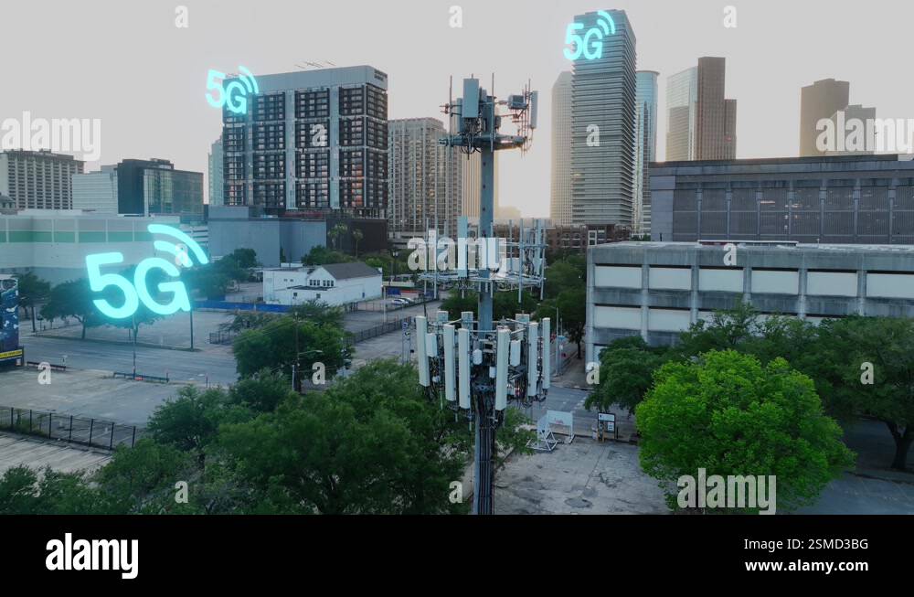 5G symbols over skyscrapers and cell tower in modern American city ...