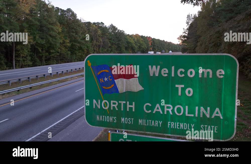 Welcome to North Carolina state sign along interstate highway. Nation's ...