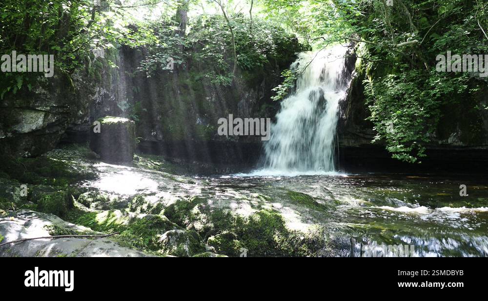 Backlit spray from a warterfall in Deepdale off Dentdale, Yorkshire ...
