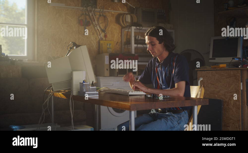 Male Caucasian Engineer Using Computer In Retro Garage Stock Video ...