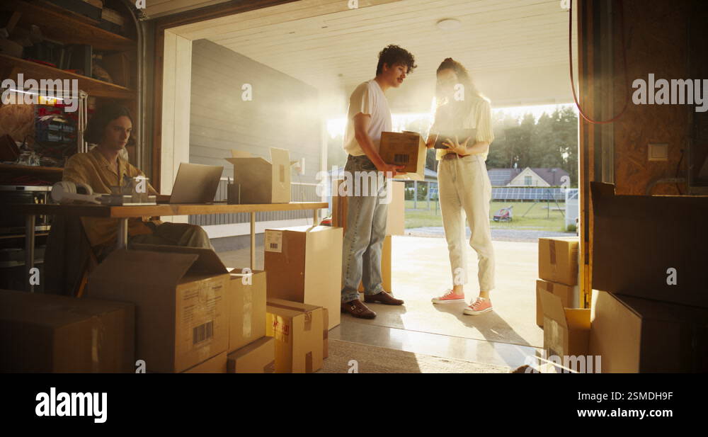 Diverse Business Partners Packaging Orders In Garage Stock Video ...