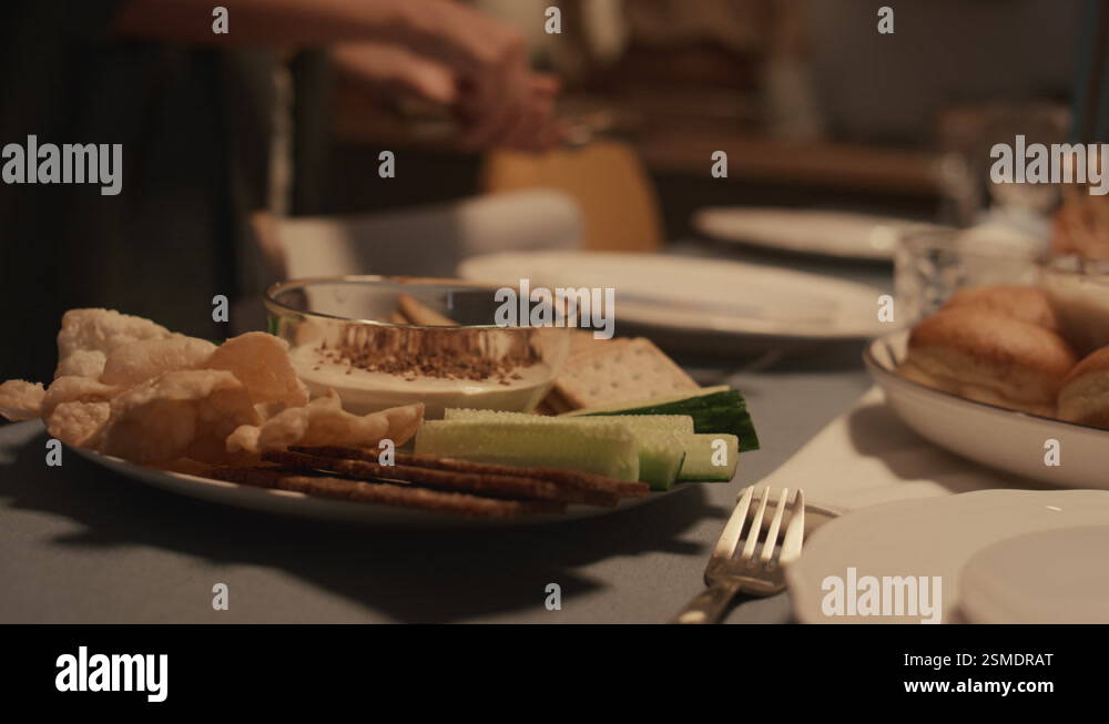 Hands of Jewish Man Putting Dish with Hummus on Table for Hanukkah ...