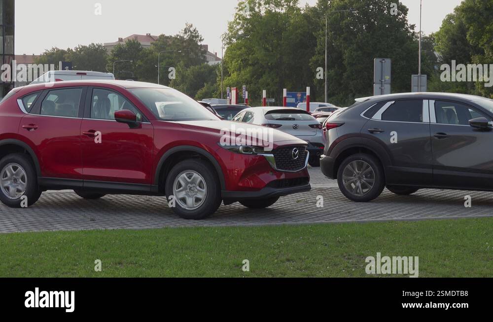 Mazda CX-5 and CX-30 crossovers presented in front of dealership in ...