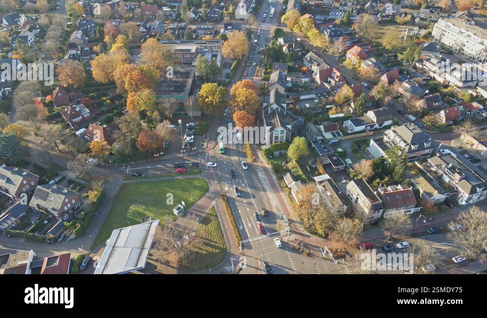 Aerial of a busy main road in beautiful rural town in autumn - drone ...