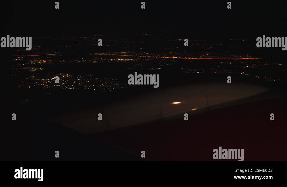 Airplane take off over night sky city lights, view from window sit ...