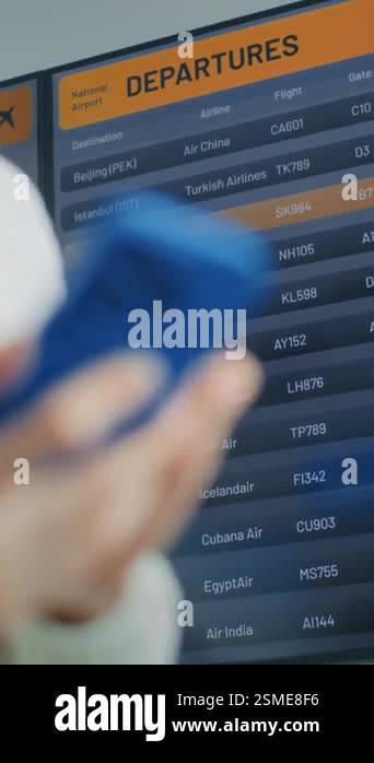 Airport Terminal: Woman Checking Information for Boarding Plane Flight Using Smartphone. Digital ...