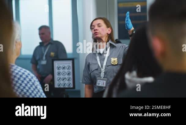 Airport Security Checkpoint: Female Security Officer Gives Instructions ...