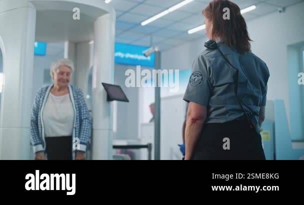 Security Checkpoint in Airport Terminal: Female Security Officer ...
