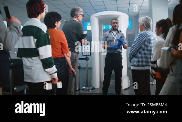 Airport Security Checkpoint: African American Security Officer Gives ...