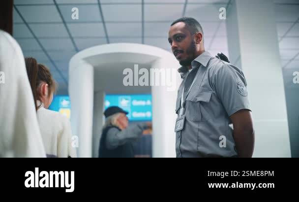 Airport Security Checkpoint: African American Security Worker Talks to ...