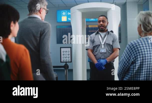Airport Security Checkpoint: African American Security Officer Gives ...