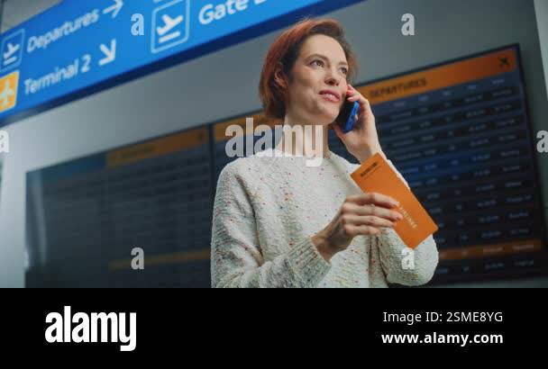 Crowded Airport Terminal: Woman Holding Plane Ticket, Talking by Phone ...