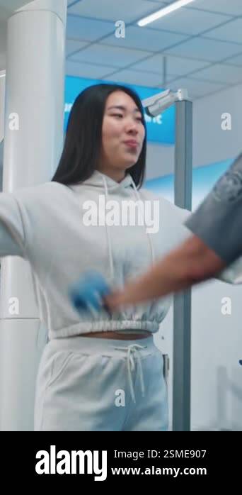 Security Checkpoint in Airport Terminal: Female Security Officer Checks ...