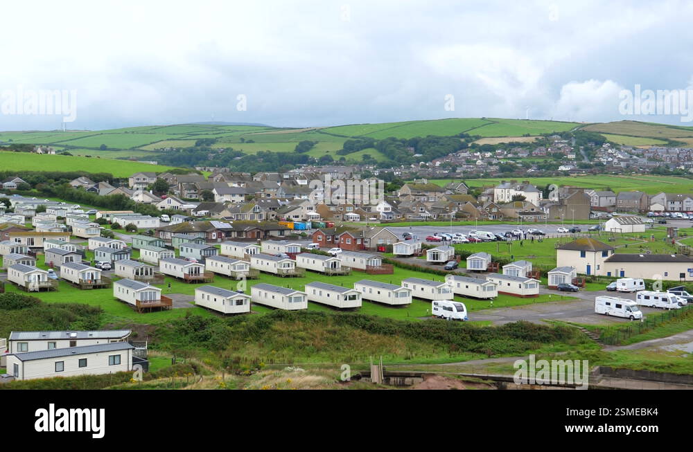 High angle panning shot of caravan park in coastal village of St. Bees ...