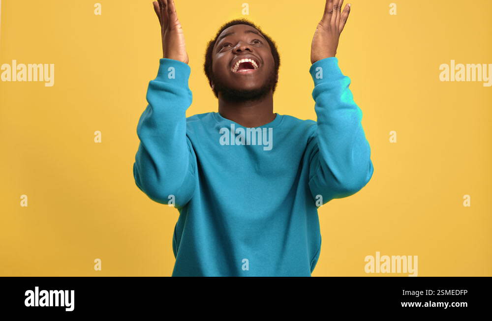 Portrait overjoyed African man rejoice good news celebrate win posing ...