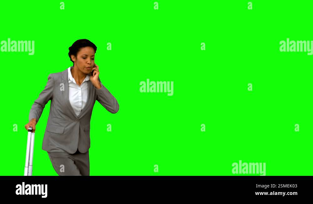 Late woman throwing her phone on green screen Stock Video Footage - Alamy