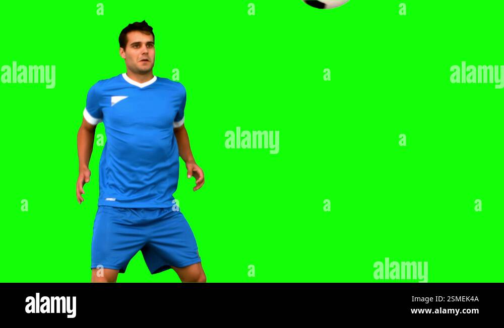 Attractive man juggling a football on green screen Stock Video Footage ...
