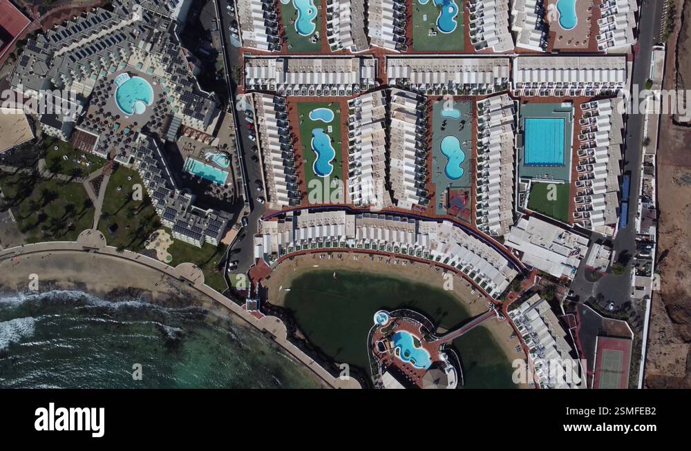 Aerial top down view of resort hotel swimming pools 4k Stock Video ...
