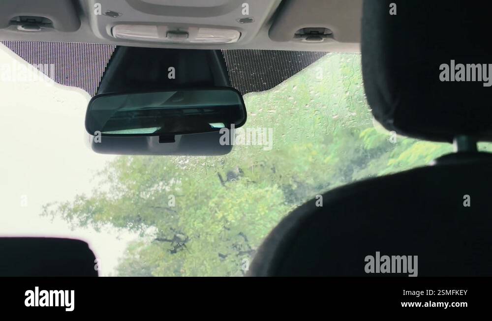 Car Interior with Rainy Windshield View Stock Video Footage - Alamy
