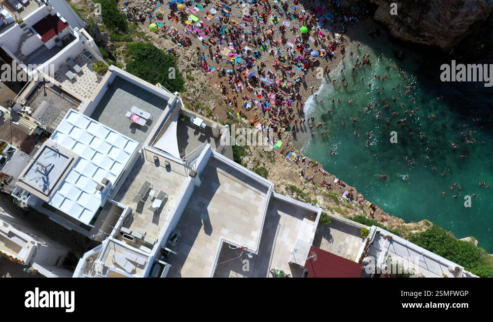 Downward angle drone shot of Lama Monachile beach on a sunny day in ...