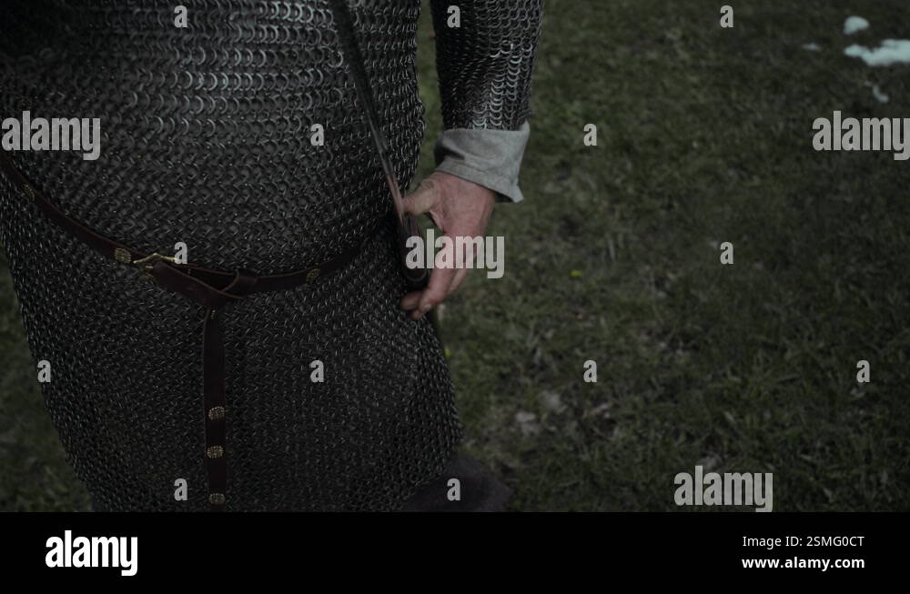 Anonymous Warrior in Chainmail Putting Sword into Sheath Stock Video ...