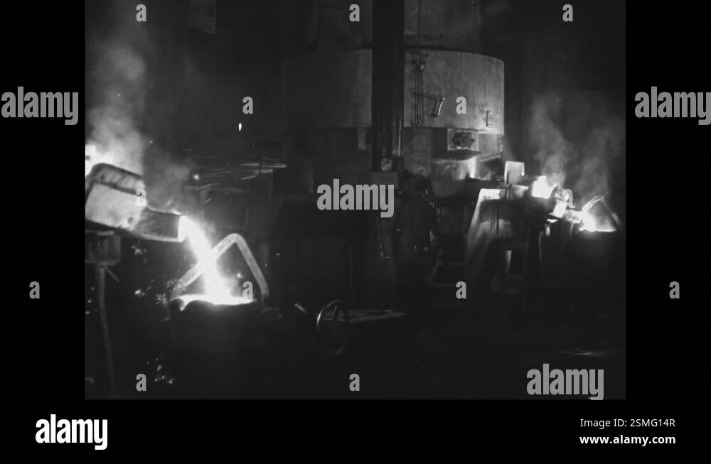 UNITED STATES 1940s: Workers pour molten metal in a steel mill Stock ...