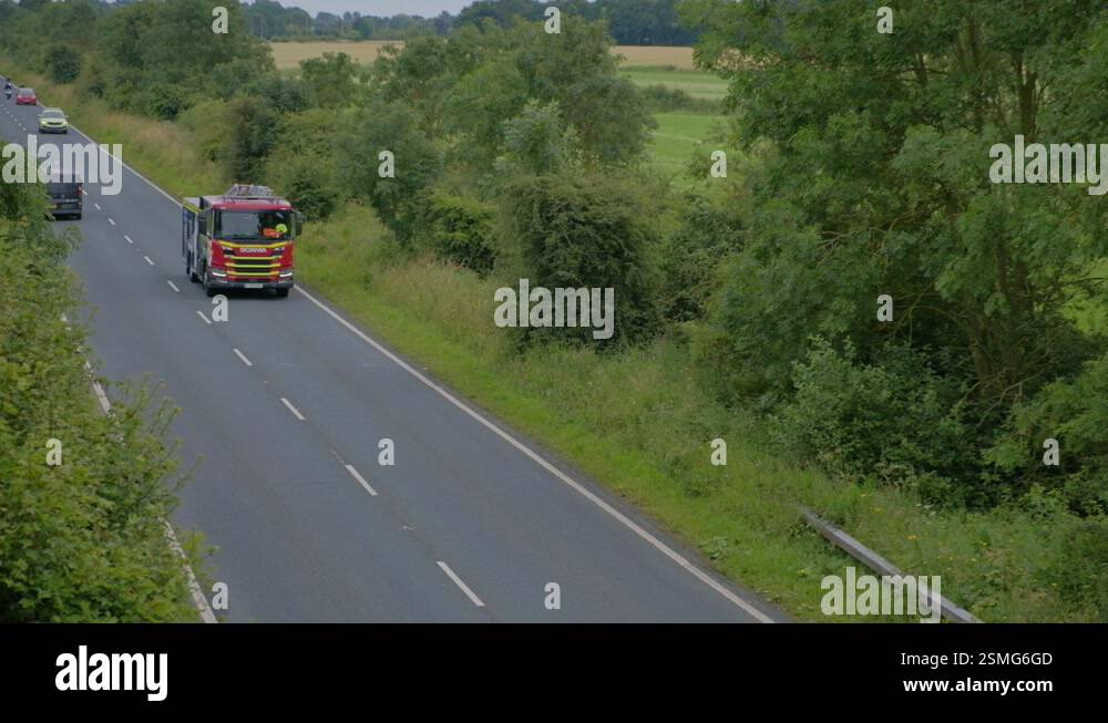 50fps. UK fire engine on a countryside road. York.UK 6.7.2024 Stock ...