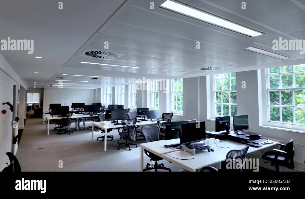 A well-lit spacious open plan empty office with modern workstations Stock Video Footage - Alamy
