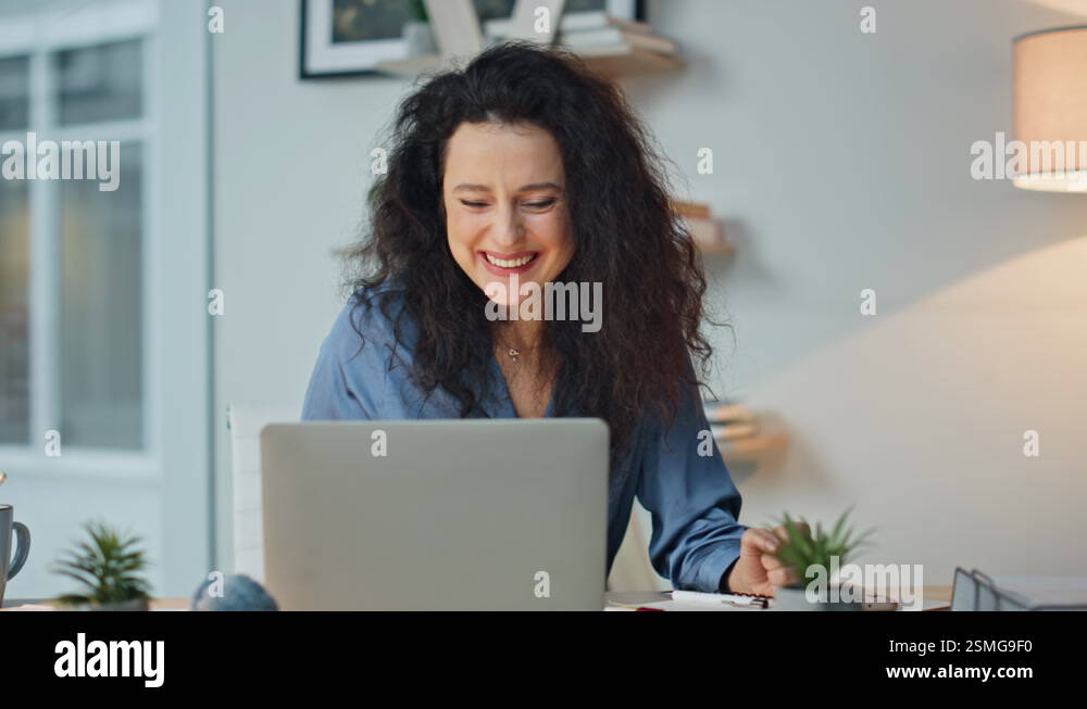 Joyful manager celebrating achievement at desk. Closeup excited ...
