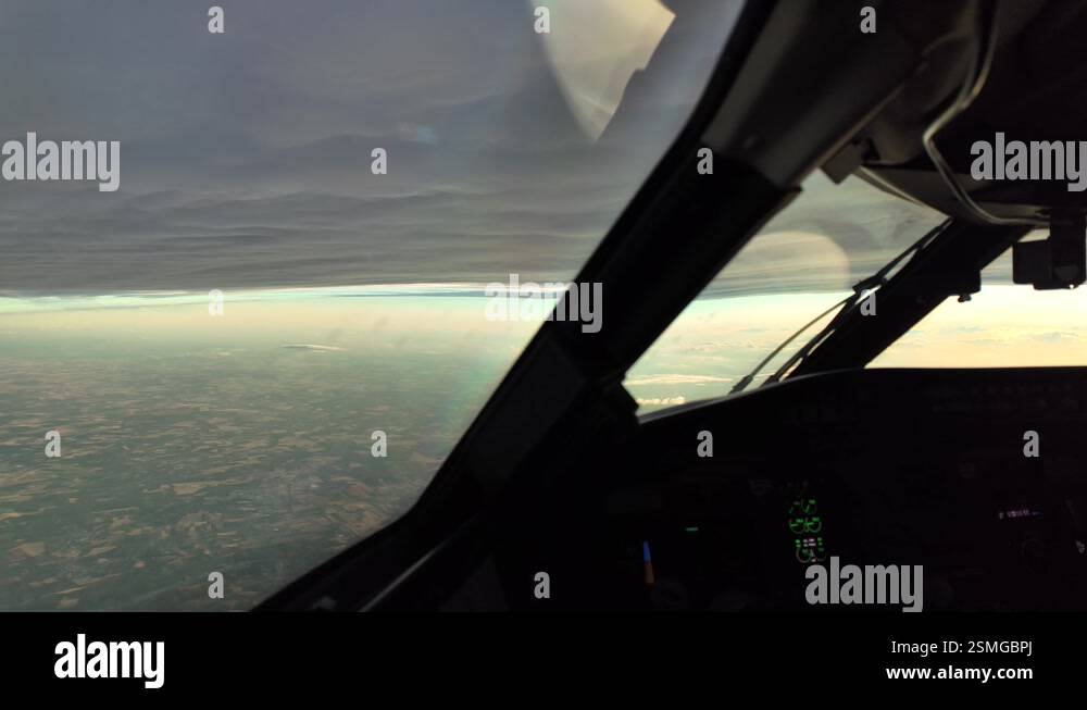 Immersive view inside a jet cockpit shot from Captain side flying under ...