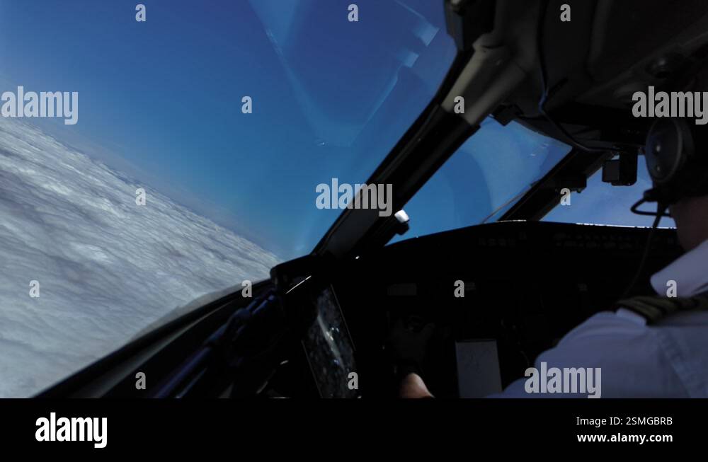 Immersive jet cockpit view in a left turn over a layer of clouds Stock ...