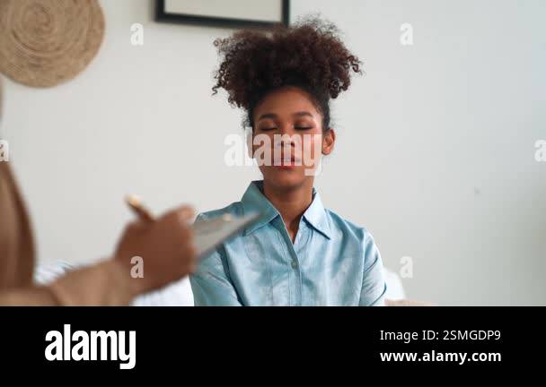 Happy patient and psychologist exchanging mental health conversation in ...