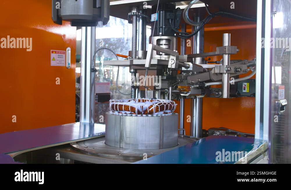 Real shot assembly line inside automated robotic assembly machine of ...