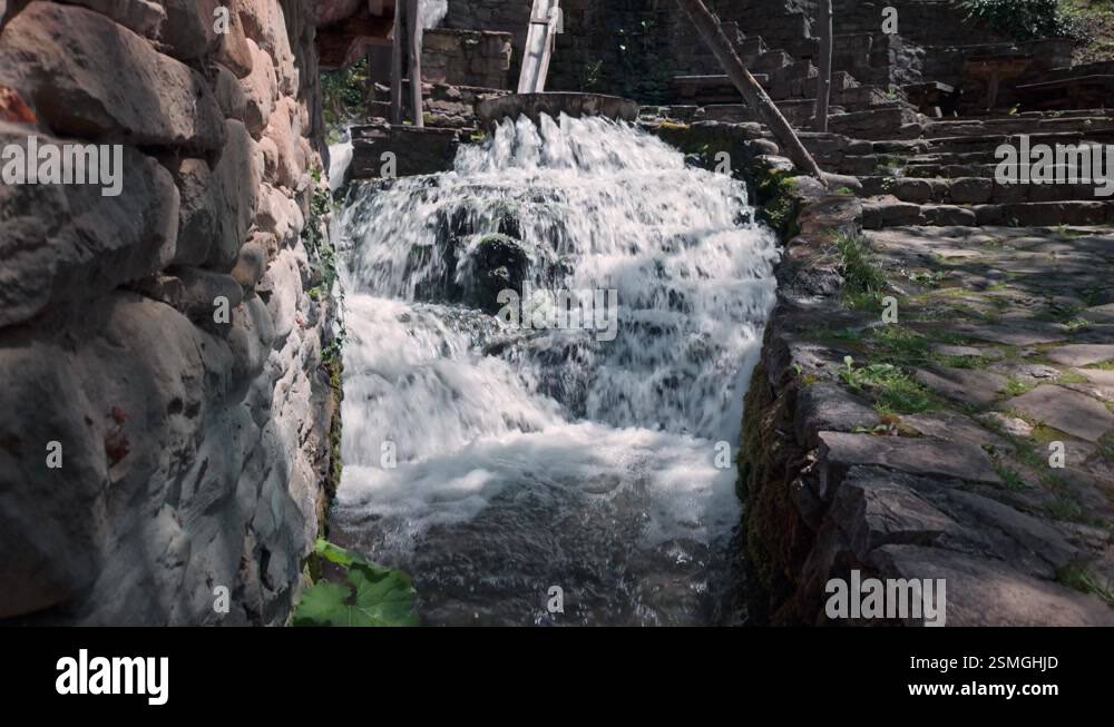 Fast flowing turbulent Water cascades from mill sluice flume Stock ...