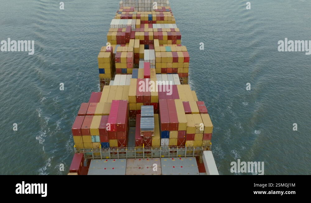 Birds eye view aerial footage centered of a cargo container ship ...