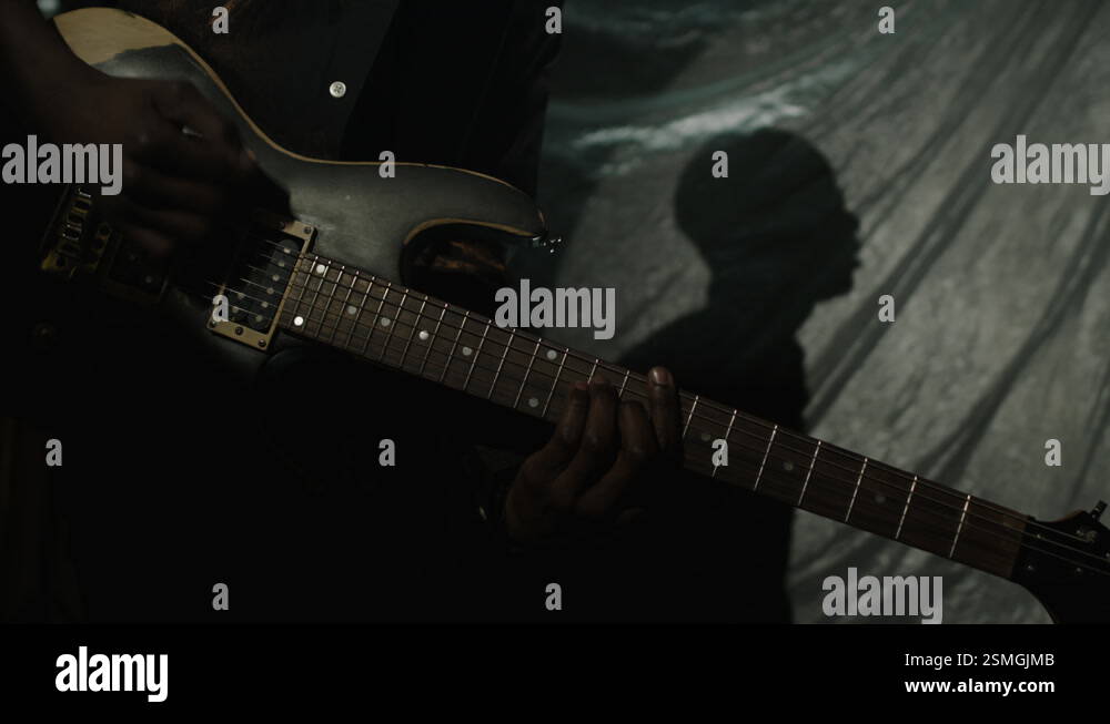 Hands and Shadow of Musician Playing Guitar on Concert Stage in ...