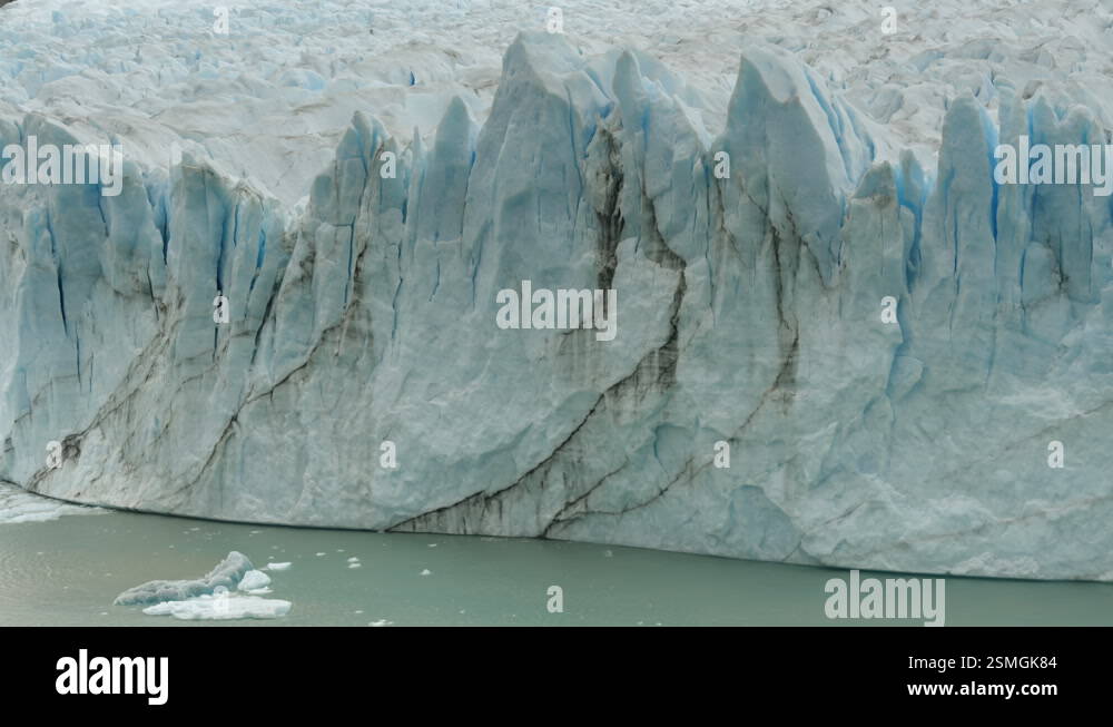 zoom in on layers of sediment in the terminus wall of perito moreno ...
