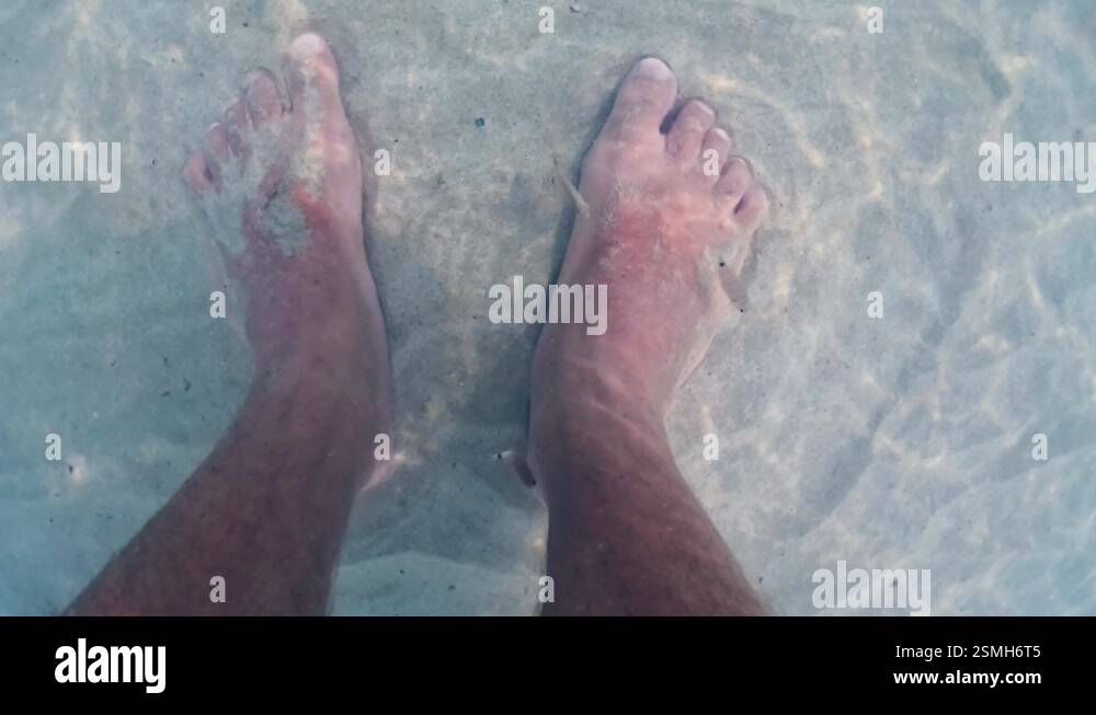 Unusual slow motion underwater footage of tiny fish eating human legs ...