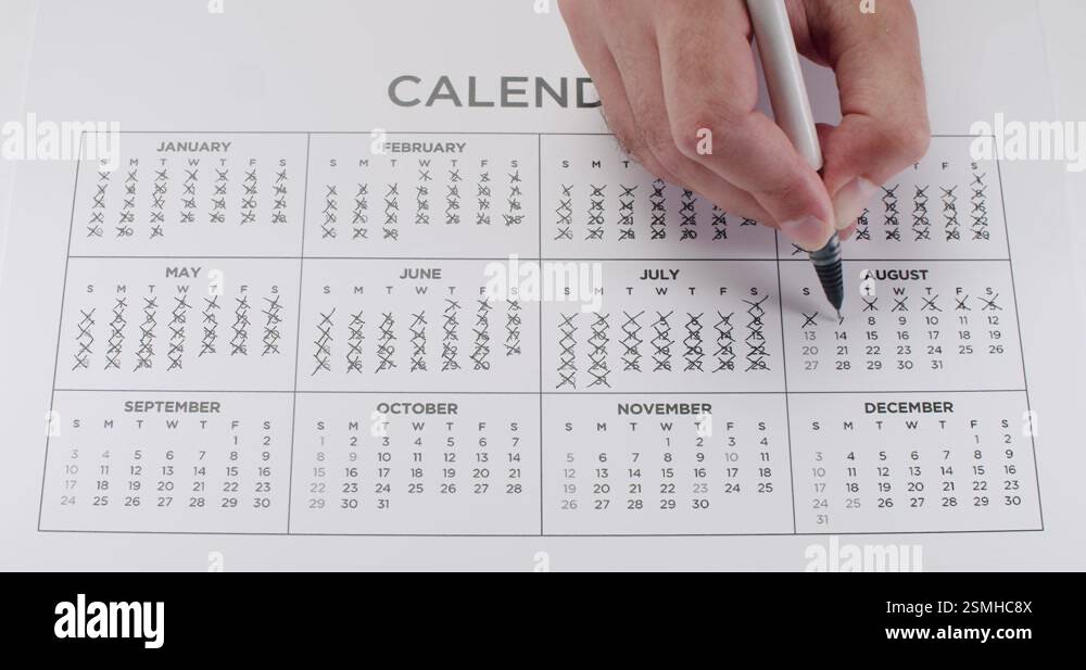 Person Marking Days Off on Calendar with Pen for Time Management Stock ...