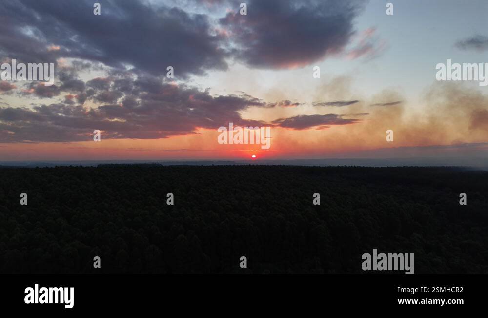 Static view on a sunset at the cloudy horizon with unique colors on the ...