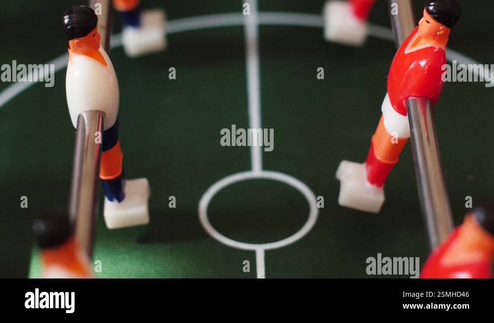 close-up table football players move on the playing field, play with ...