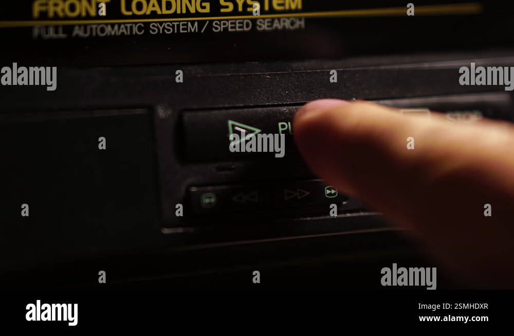 Inserting VHS Tape and Pressing Play Button on 1980's Video Player ...